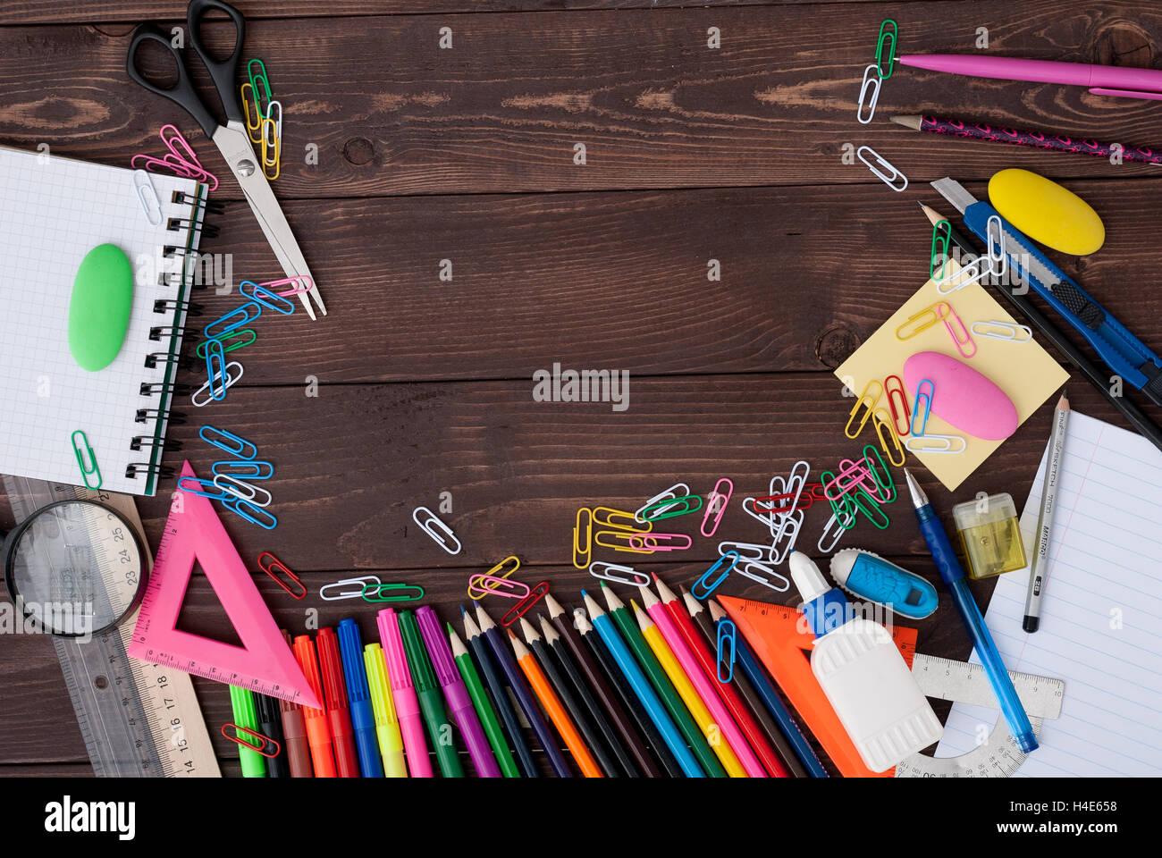School supplies on a wooden table Stock Photo - Alamy
