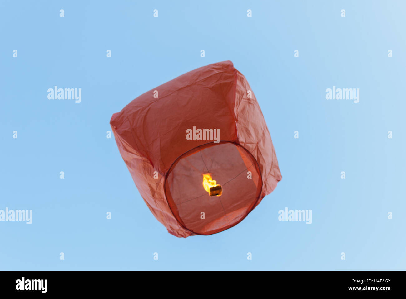 Hand lighting flame paper lantern hi-res stock photography and images ...