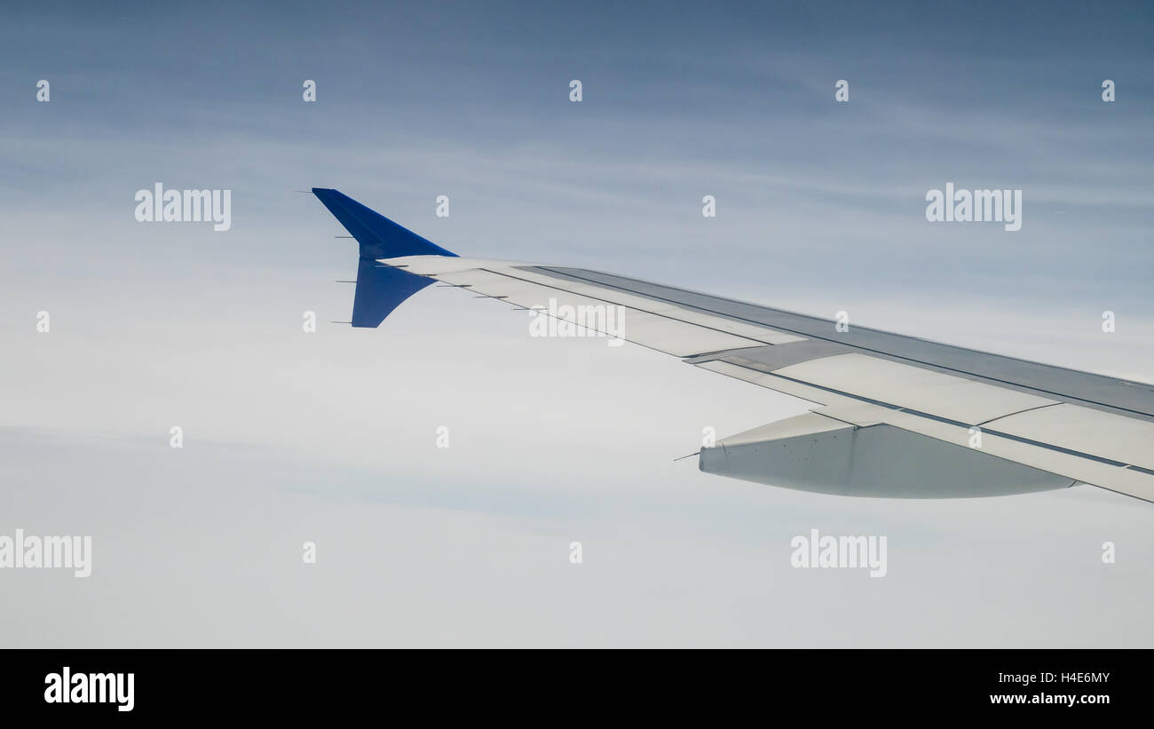 The airplane wing on the beautiful cloudy and sky Stock Photo - Alamy
