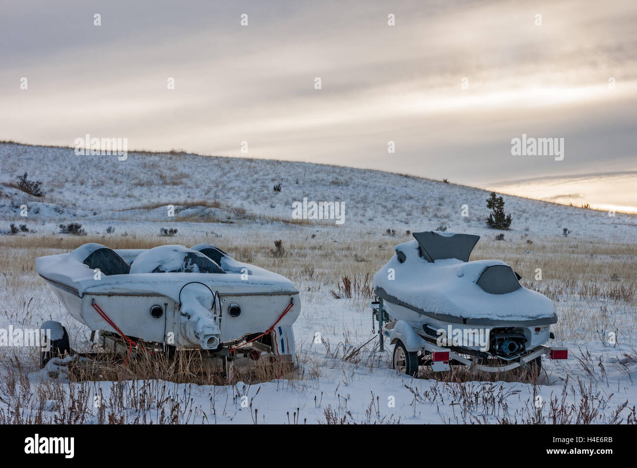 Boat and jet ski collecting snow during the winter Stock Photo - Alamy