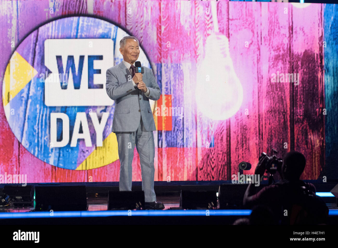 George Tekai speaks to the crowd at WE Day Seattle in Key Arena Stock ...