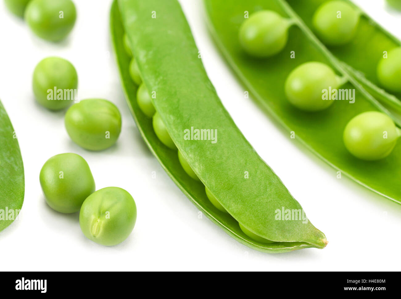 Young grean peas closeup isolated on white background Stock Photo - Alamy