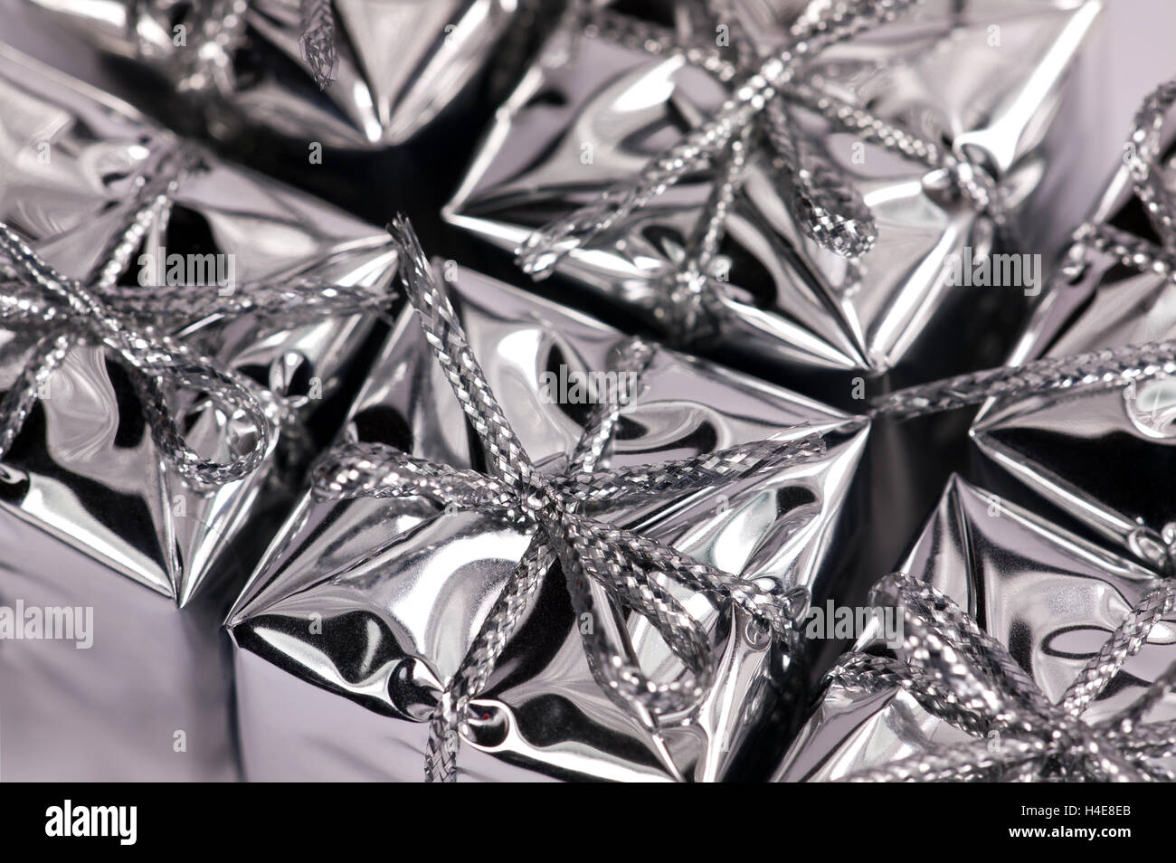 Silver Christmas gift boxes Stock Photo - Alamy