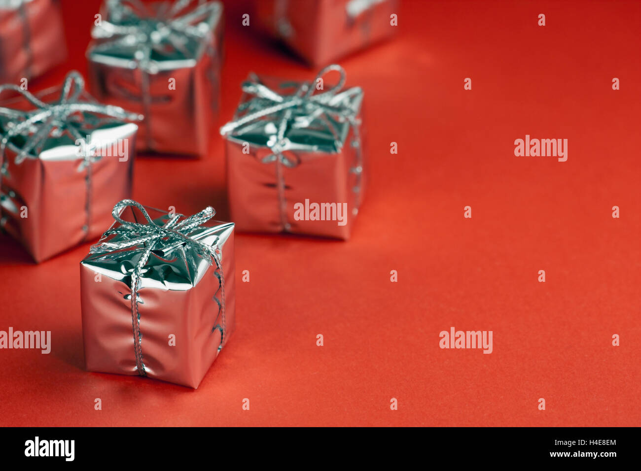 Christmas presents on red background Stock Photo - Alamy