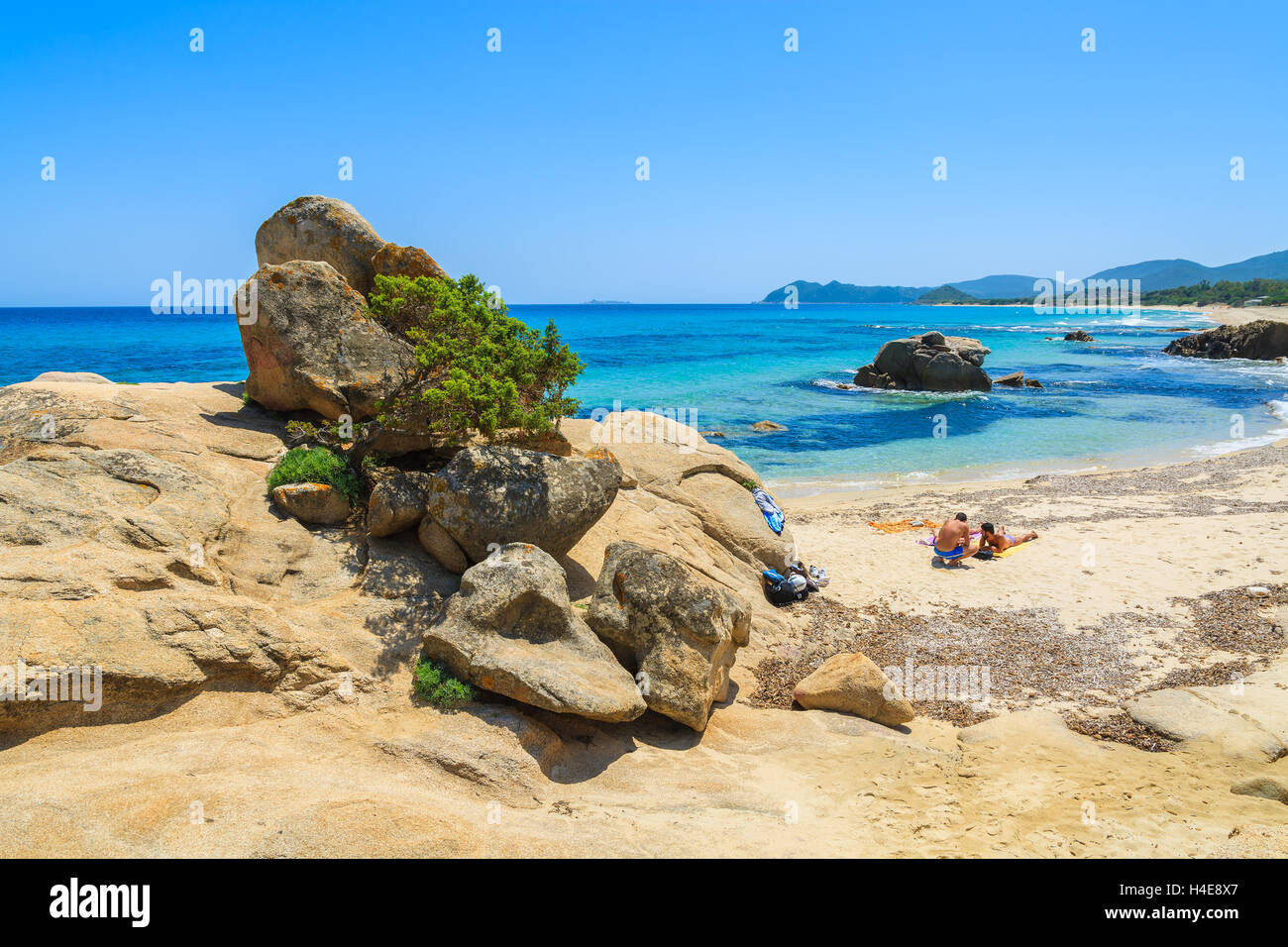 Rocks on coast Sardinia island near Peppino beach with two unidentified ...