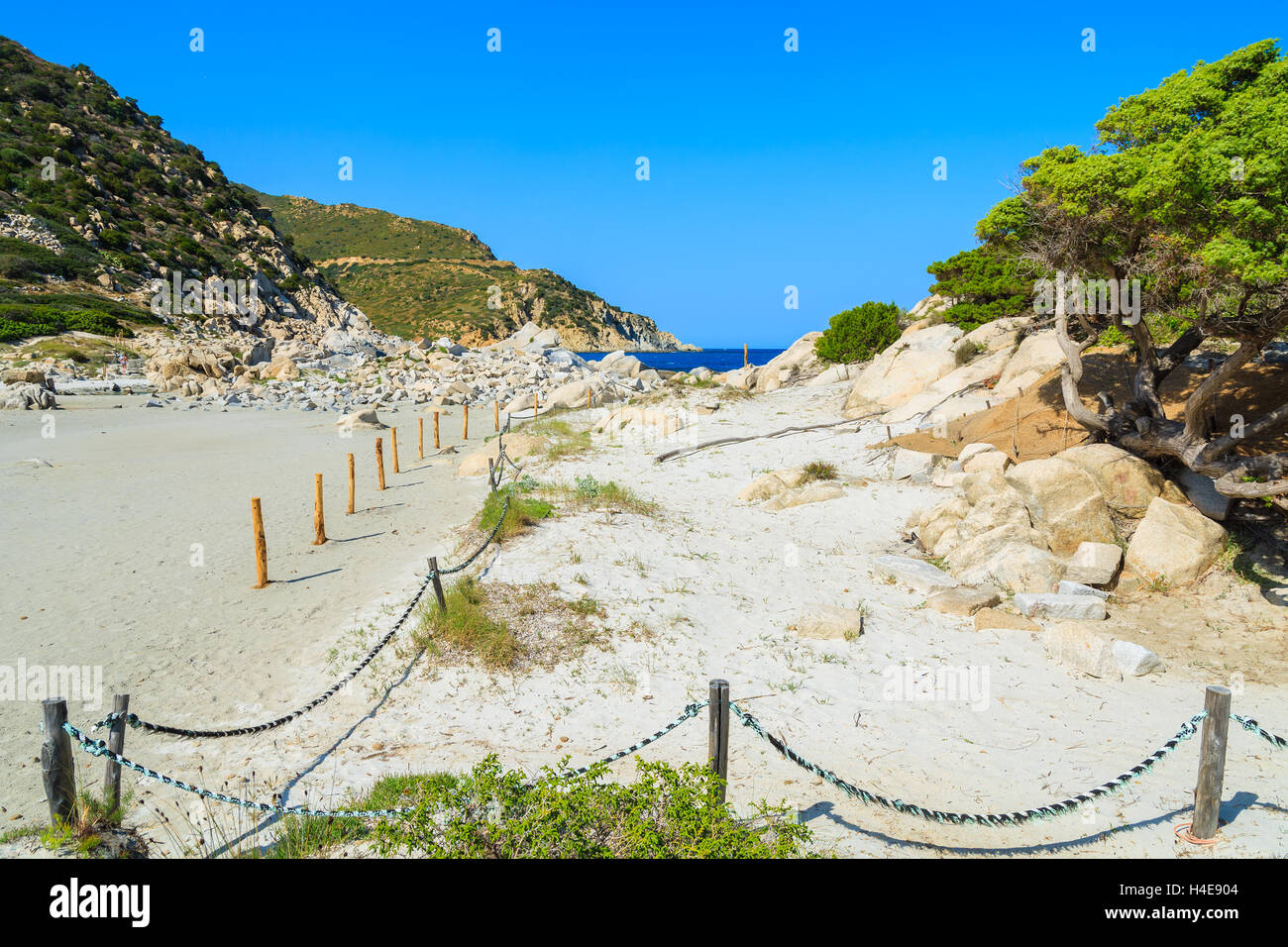 Walking path on sand dunes at Punta Molentis bay, Sardinia island ...