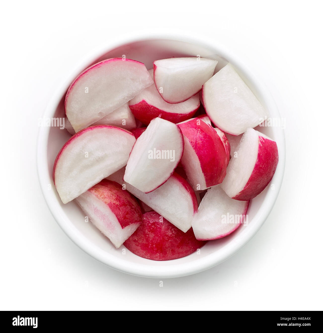 Bowl of radish lobes isolated on white background, top view Stock Photo ...