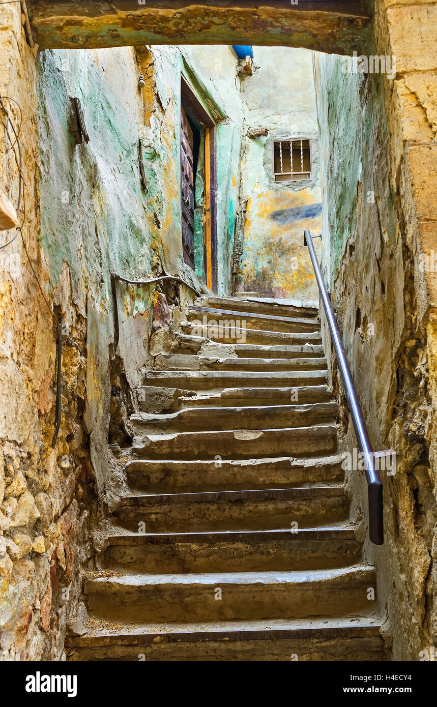 The ramshackle staircase and the crumbling walls in slum, located in ...