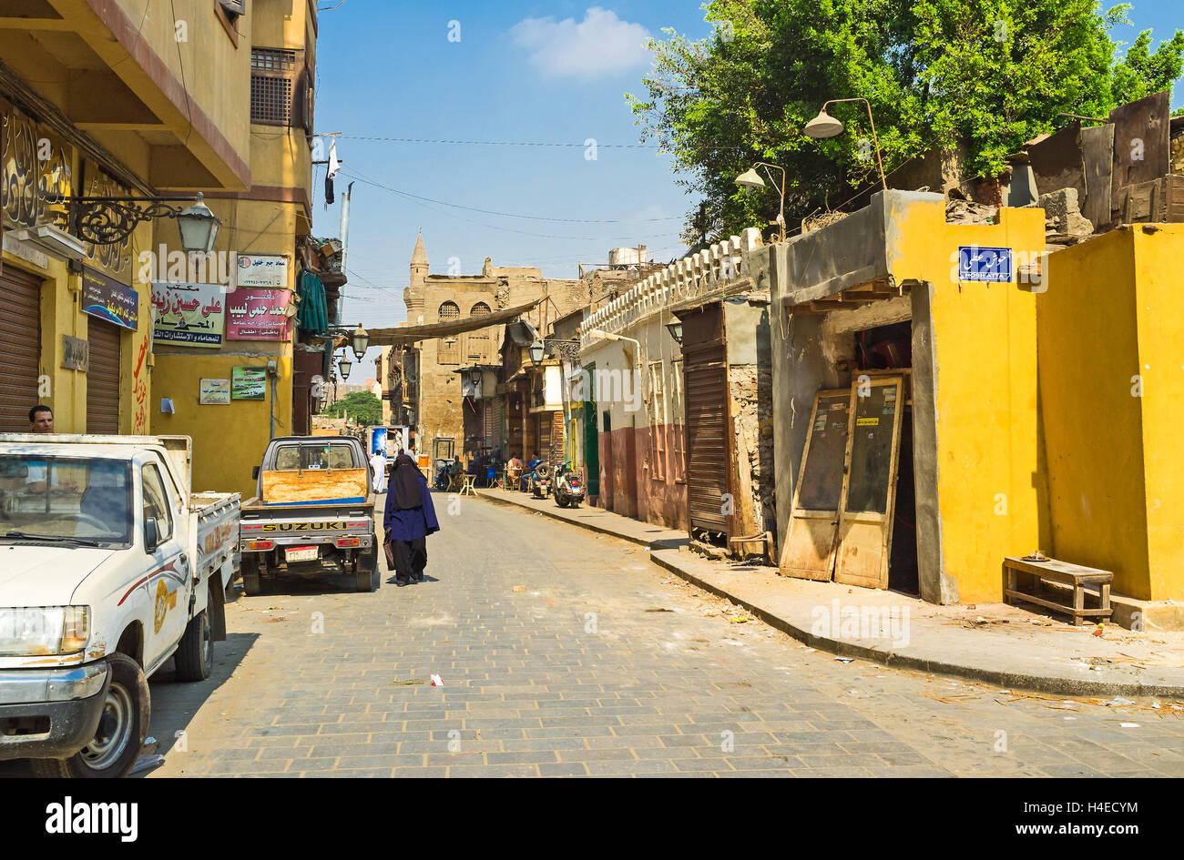 The residential street with old houses and dusty road, Cairo Egypt ...