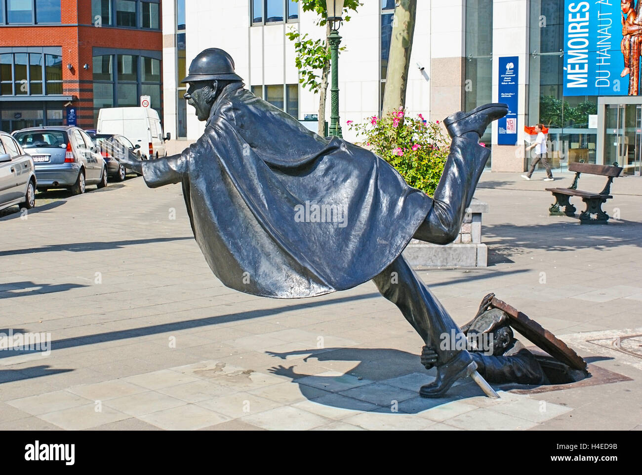 Tom Frantzen’s sculpture depicts a policeman about to fall head over ...