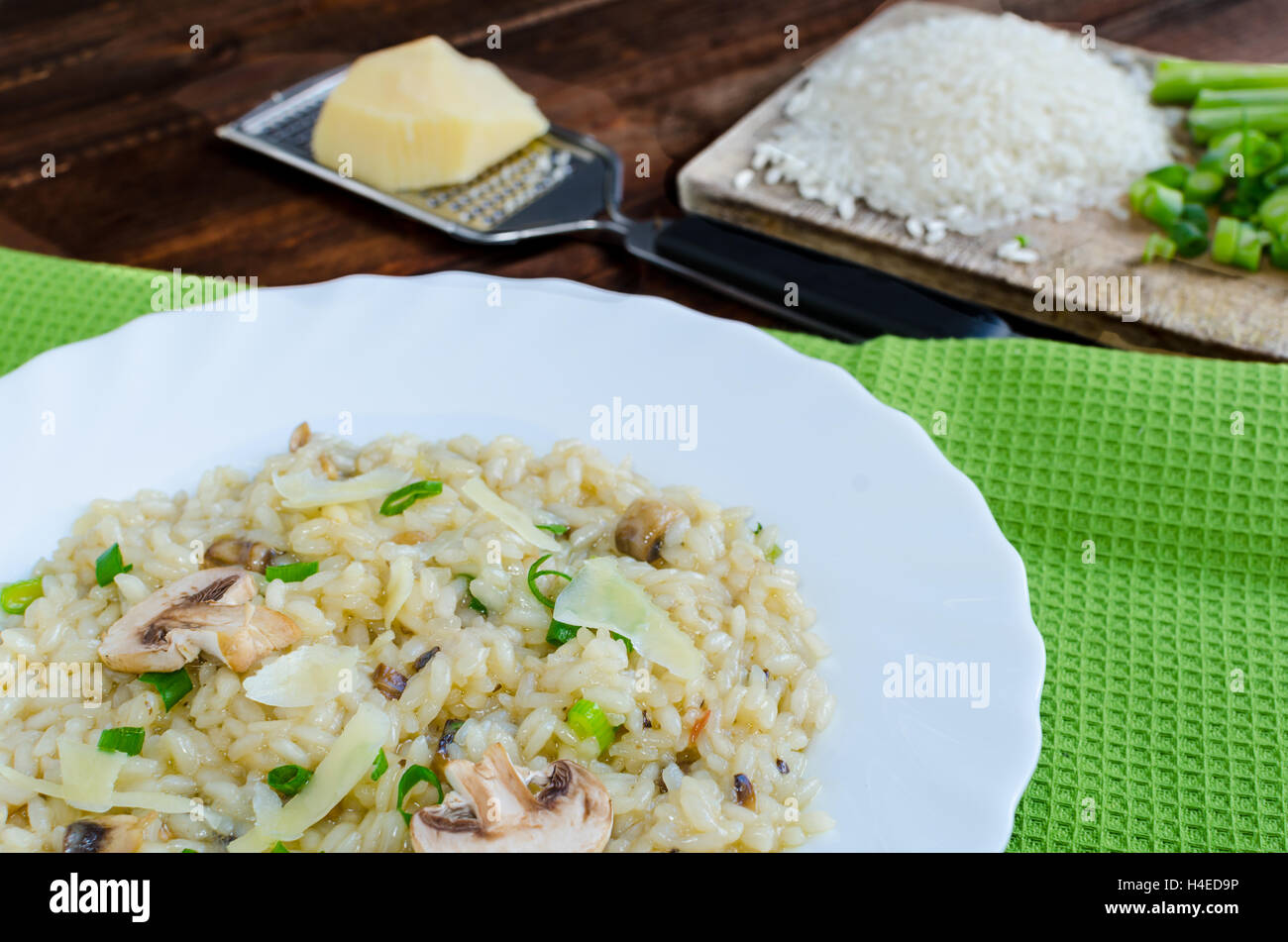 Italien risotto with mushrooms and spring onion Stock Photo - Alamy