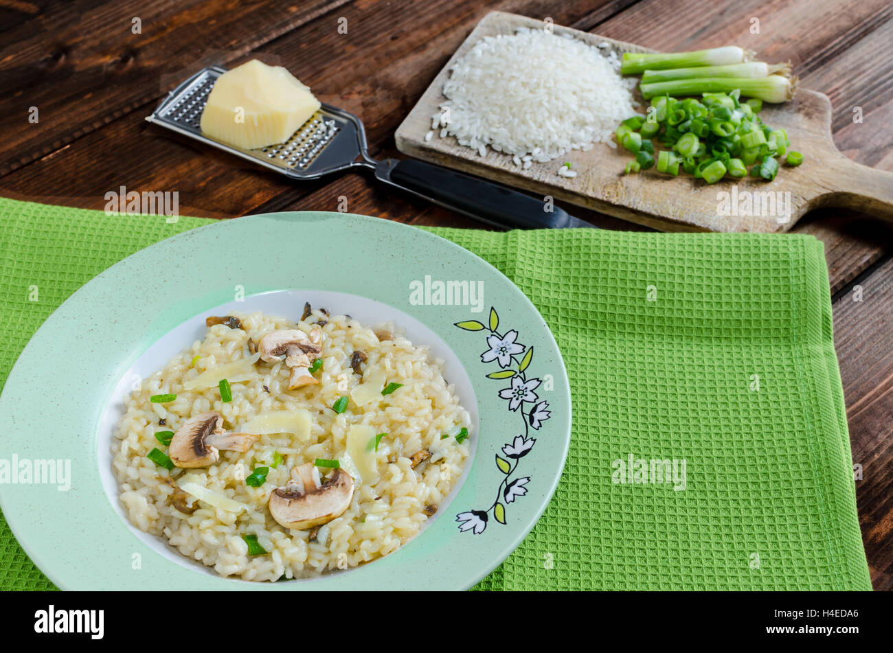 Italien risotto with mushrooms and spring onion Stock Photo - Alamy