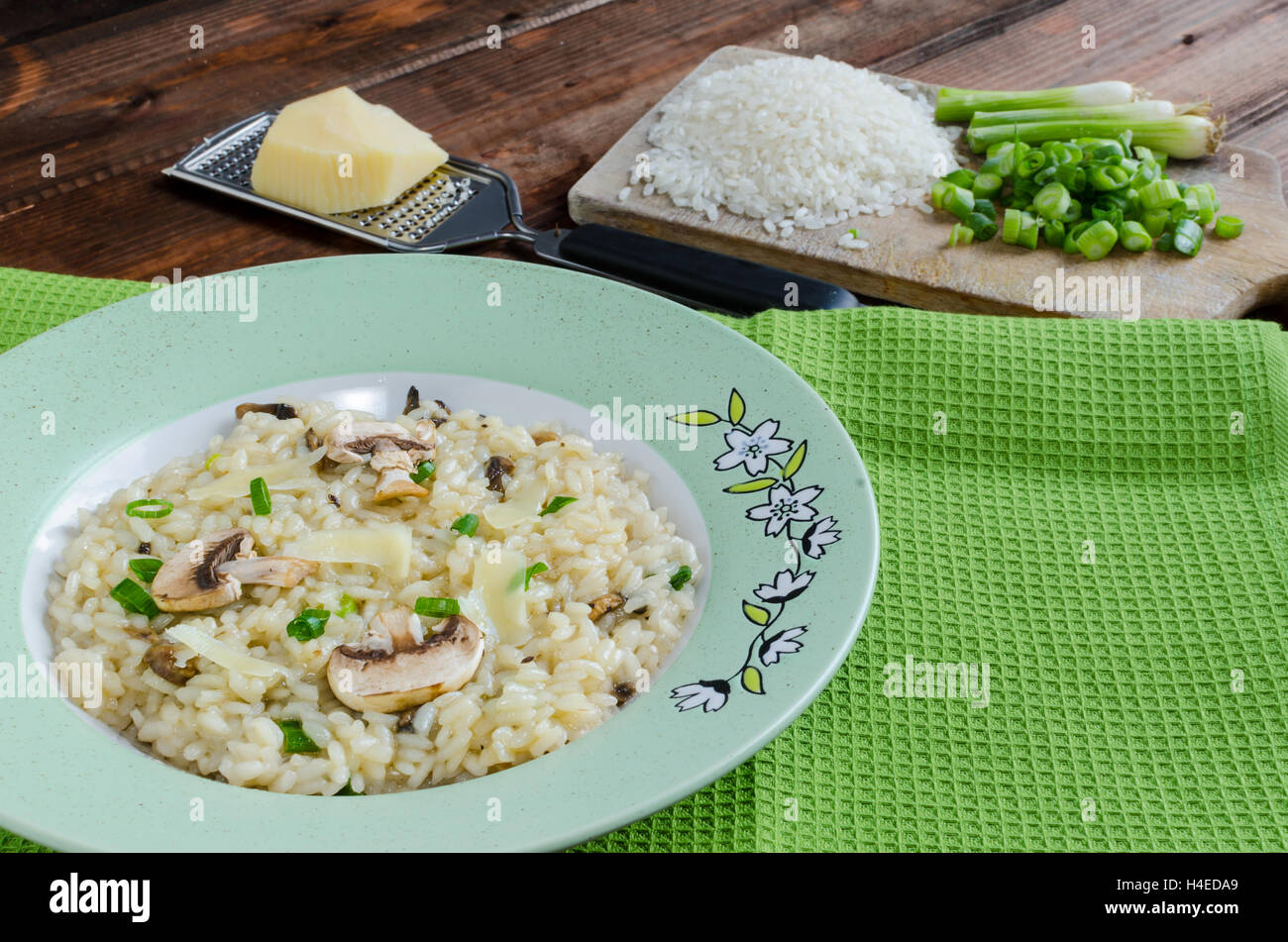 Italien risotto with mushrooms and spring onion Stock Photo - Alamy