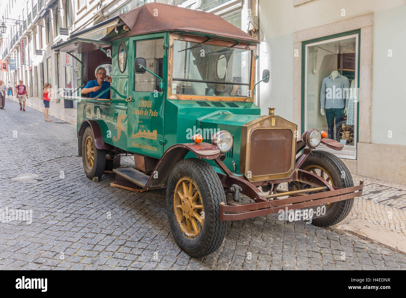A restored antique truck selling traditional Portuguese fado music in ...