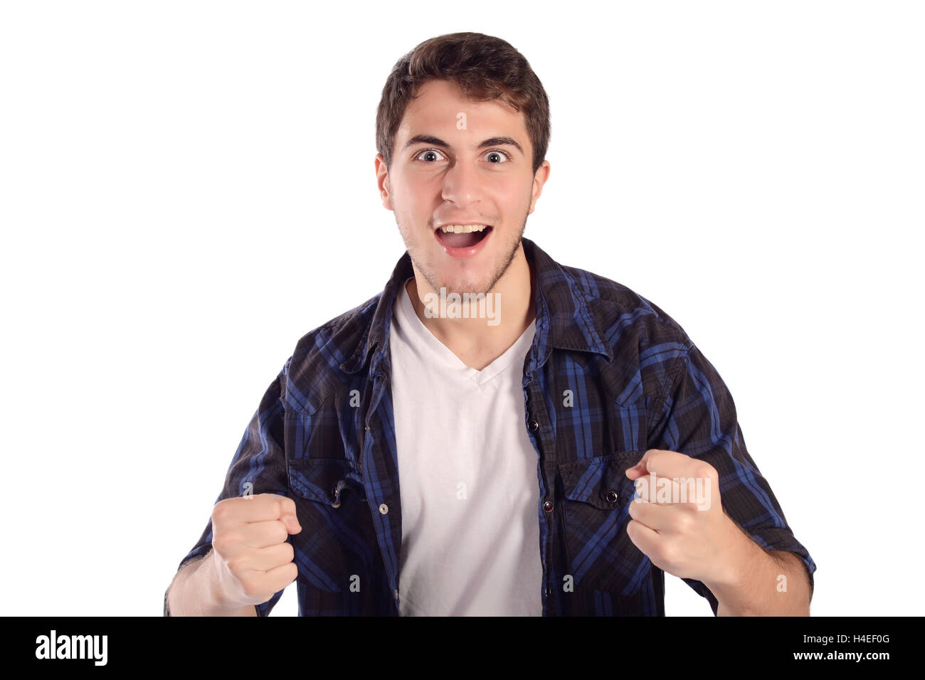 Portrait of a happy young man celebrating victory. Isolated white ...