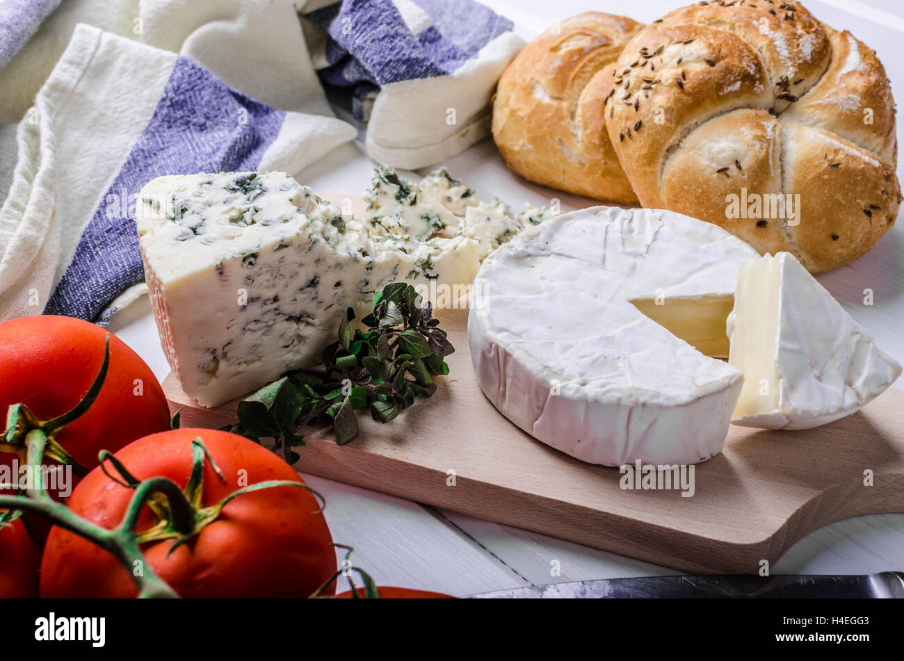 Gourmet cheeses - camembert and blue cheese on a cutting board ...
