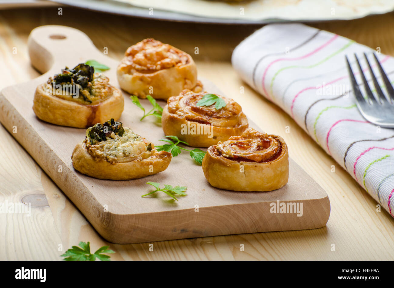 Canapés puff pastry with spinach, garlic blue cheese, easy snack Stock ...