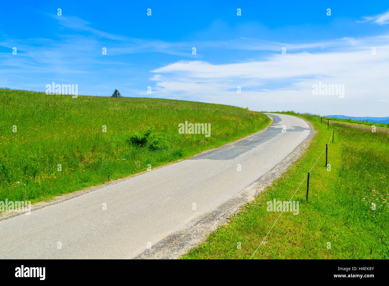 Scenic mountain road in green field, Lapszanka, Tatry Mountains Stock ...