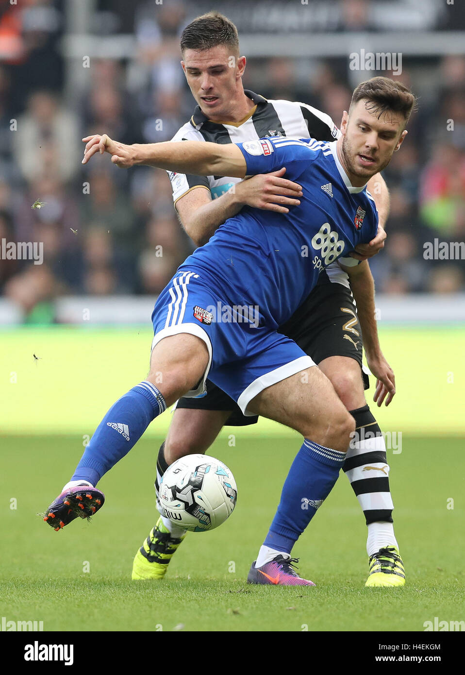 Newcastle United's Ciaran Clark (left) and Brentford's Scott Hogan ...