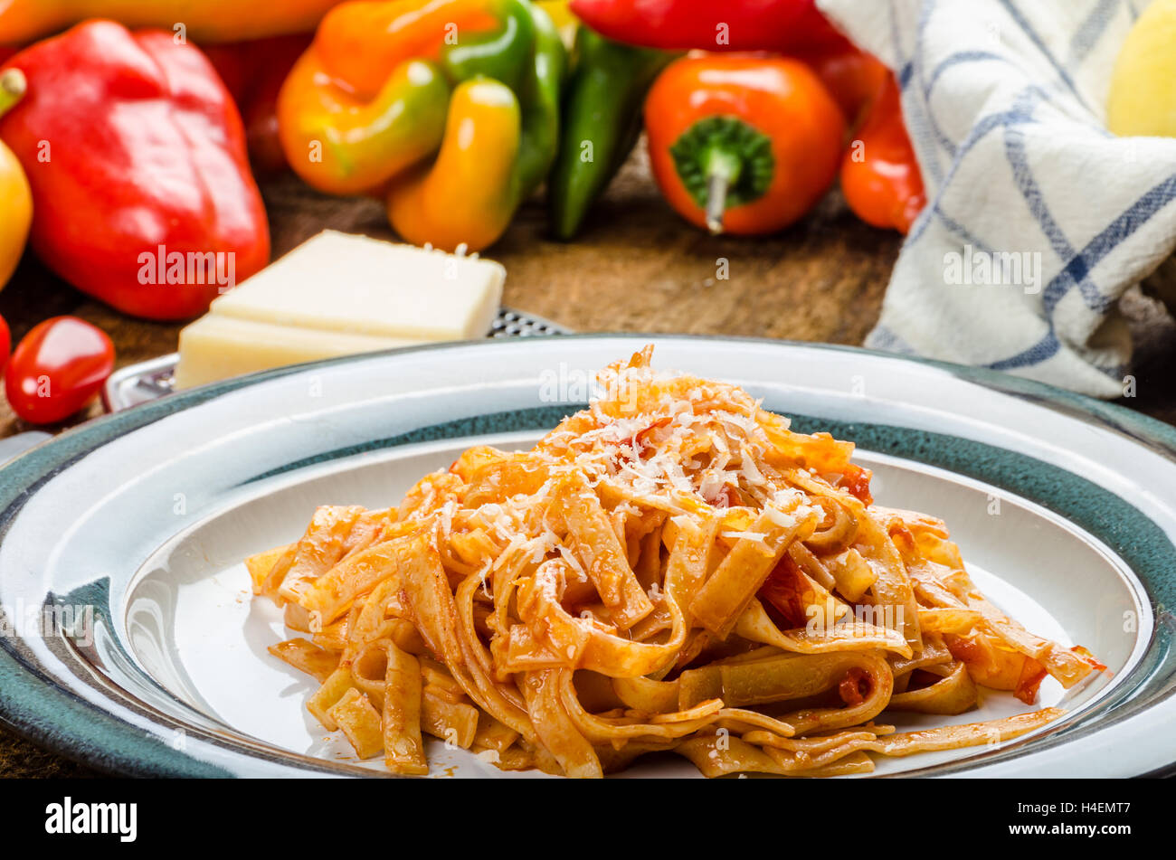 Pasta arrabiata with peppers from bio garden Stock Photo - Alamy