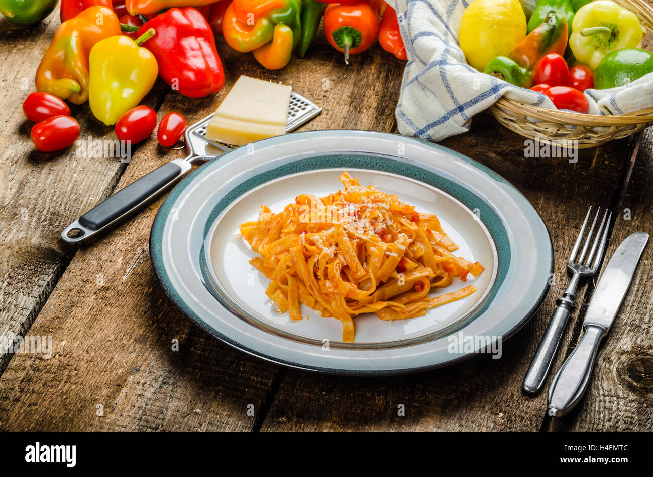 Pasta arrabiata with peppers from bio garden Stock Photo - Alamy