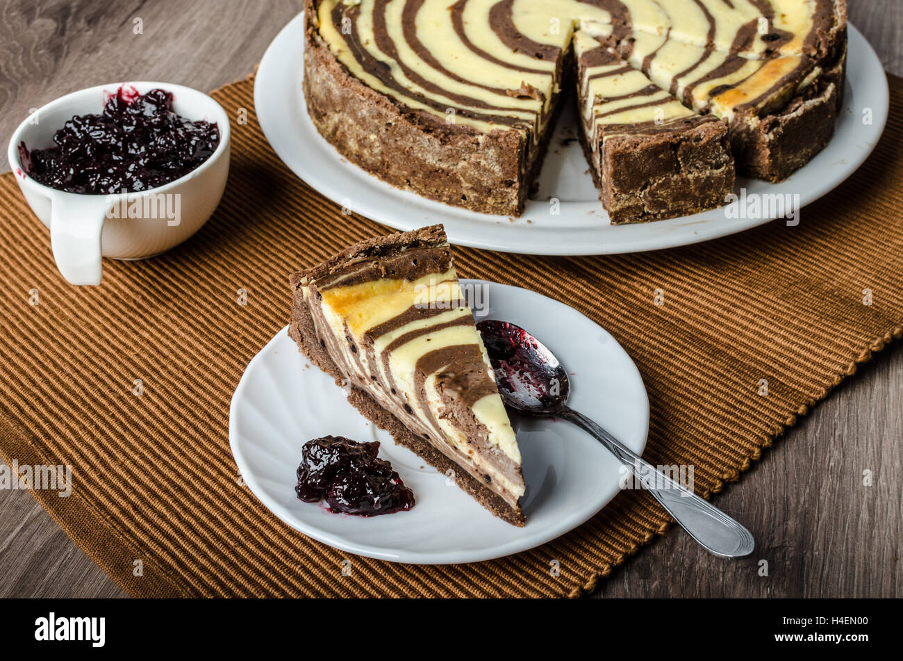 Two-tone cheesecake with homemade cherry jam, homamade Stock Photo - Alamy