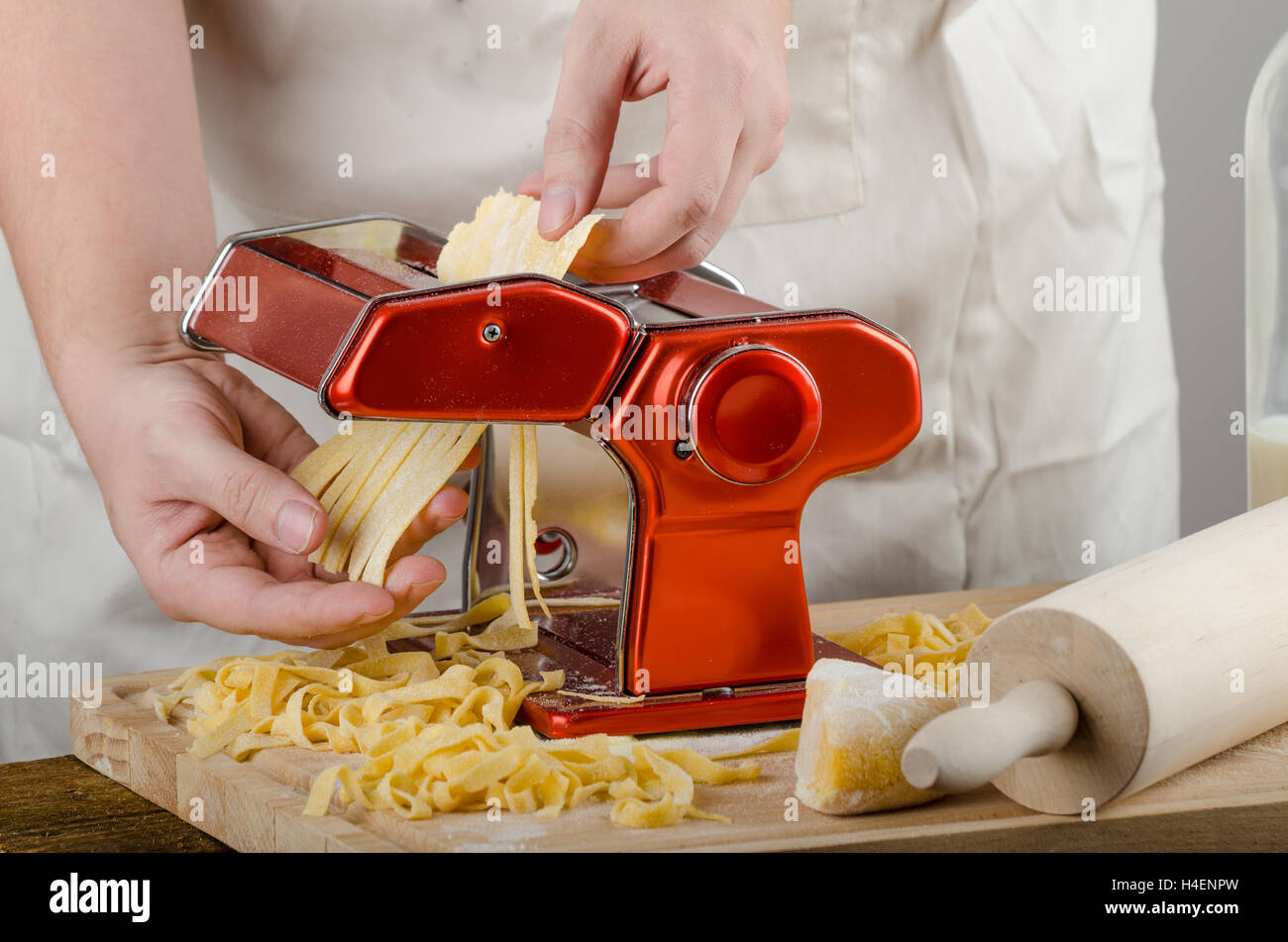 Chef production pasta - Italian pasta grinder, wood board, rolling-pin ...