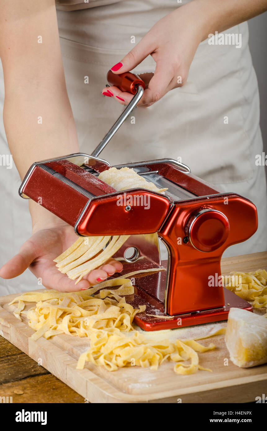 Chef production pasta - Italian pasta grinder, wood board, rolling-pin ...
