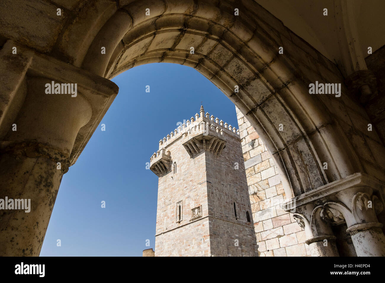 Looking through an arched opening at the Castle tower in Estremoz ...
