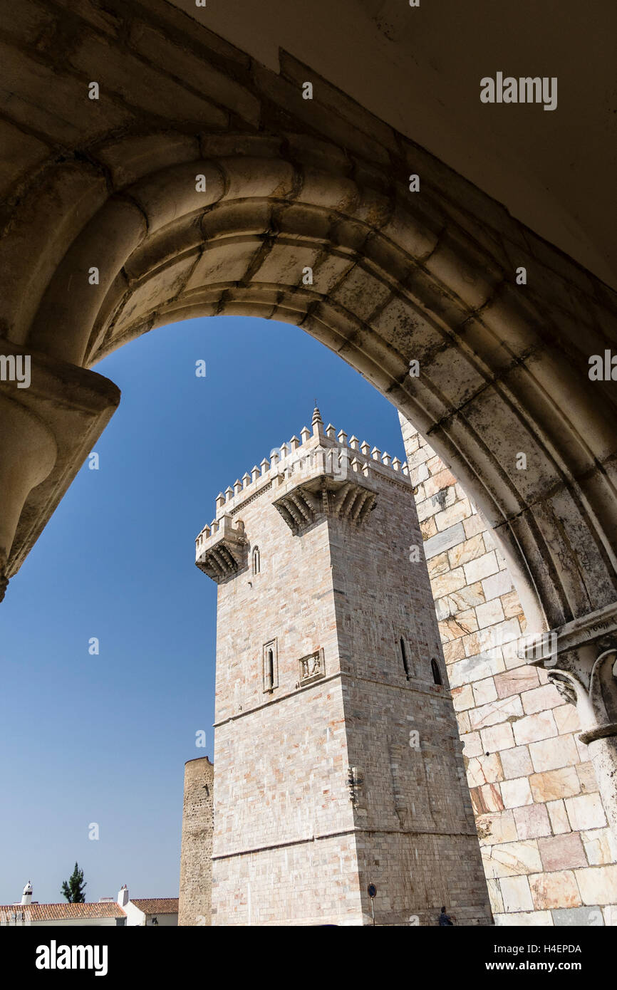 Looking through an arched opening at the Castle tower in Estremoz ...