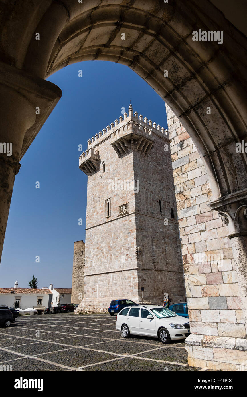 Looking through an arched opening at the Castle tower in Estremoz ...