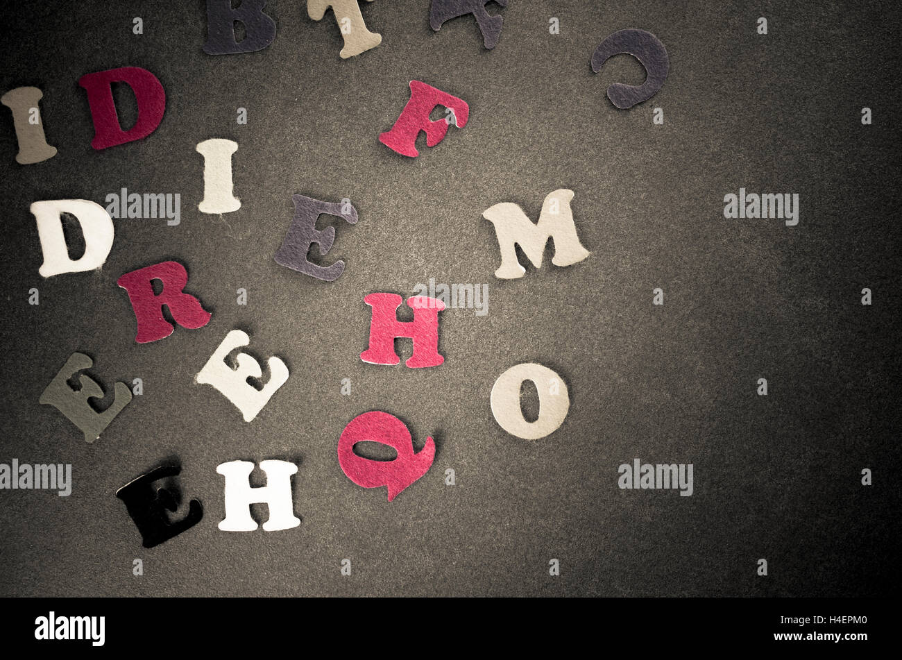 random felt cut alphabet letters on a dark slate worktop Stock Photo ...