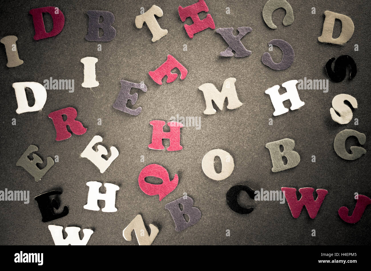 random felt cut alphabet letters on a dark slate worktop Stock Photo ...