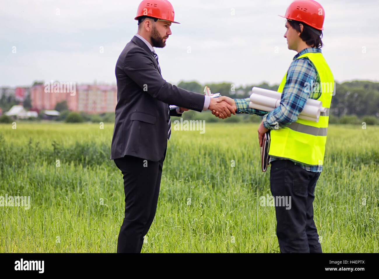 construction two man in the field Stock Photo - Alamy