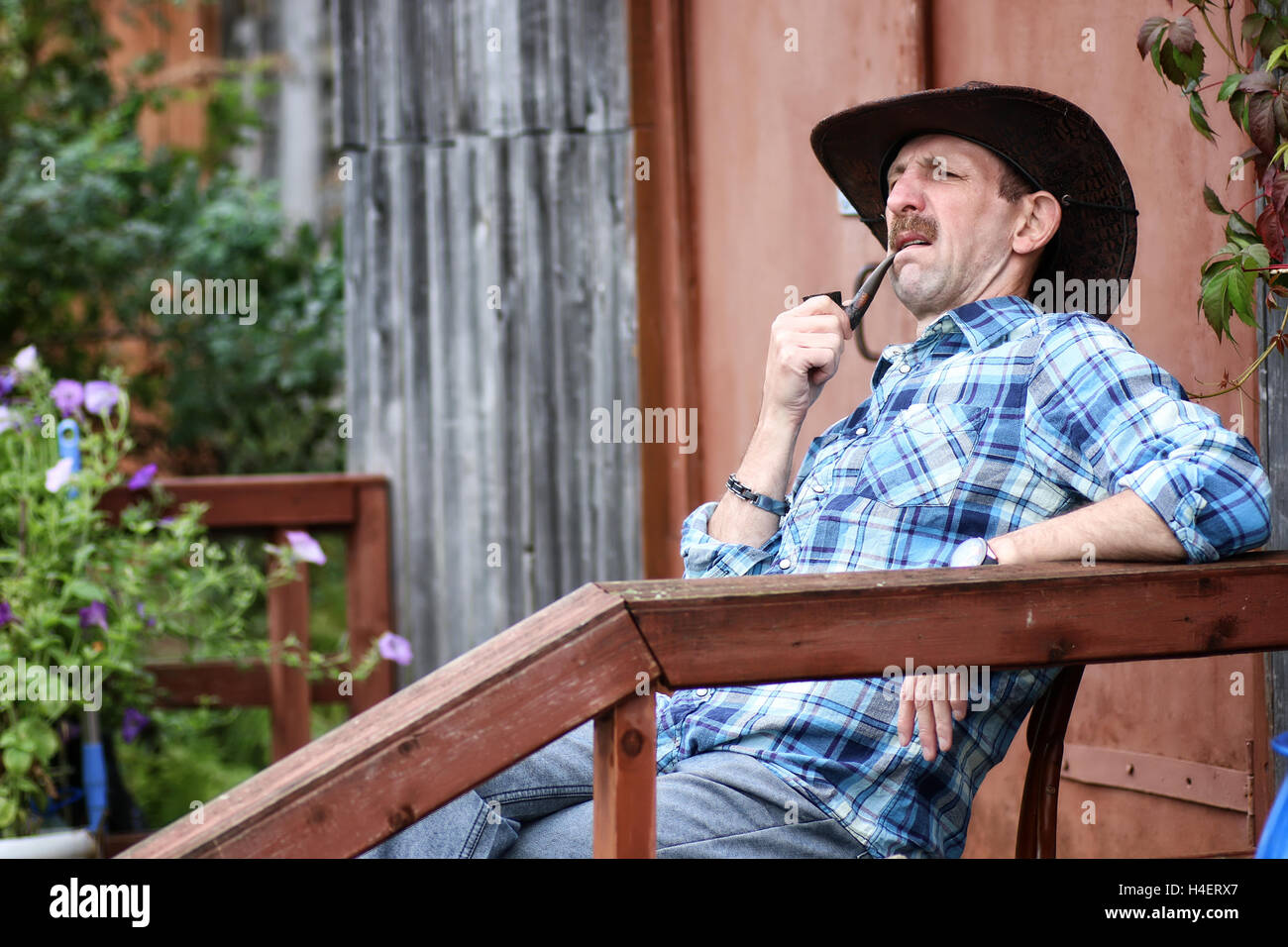 cowboy man smoke pipe Stock Photo - Alamy