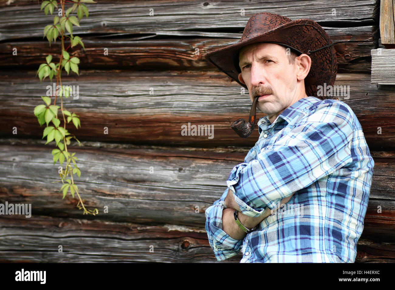 cowboy man smoke pipe Stock Photo - Alamy
