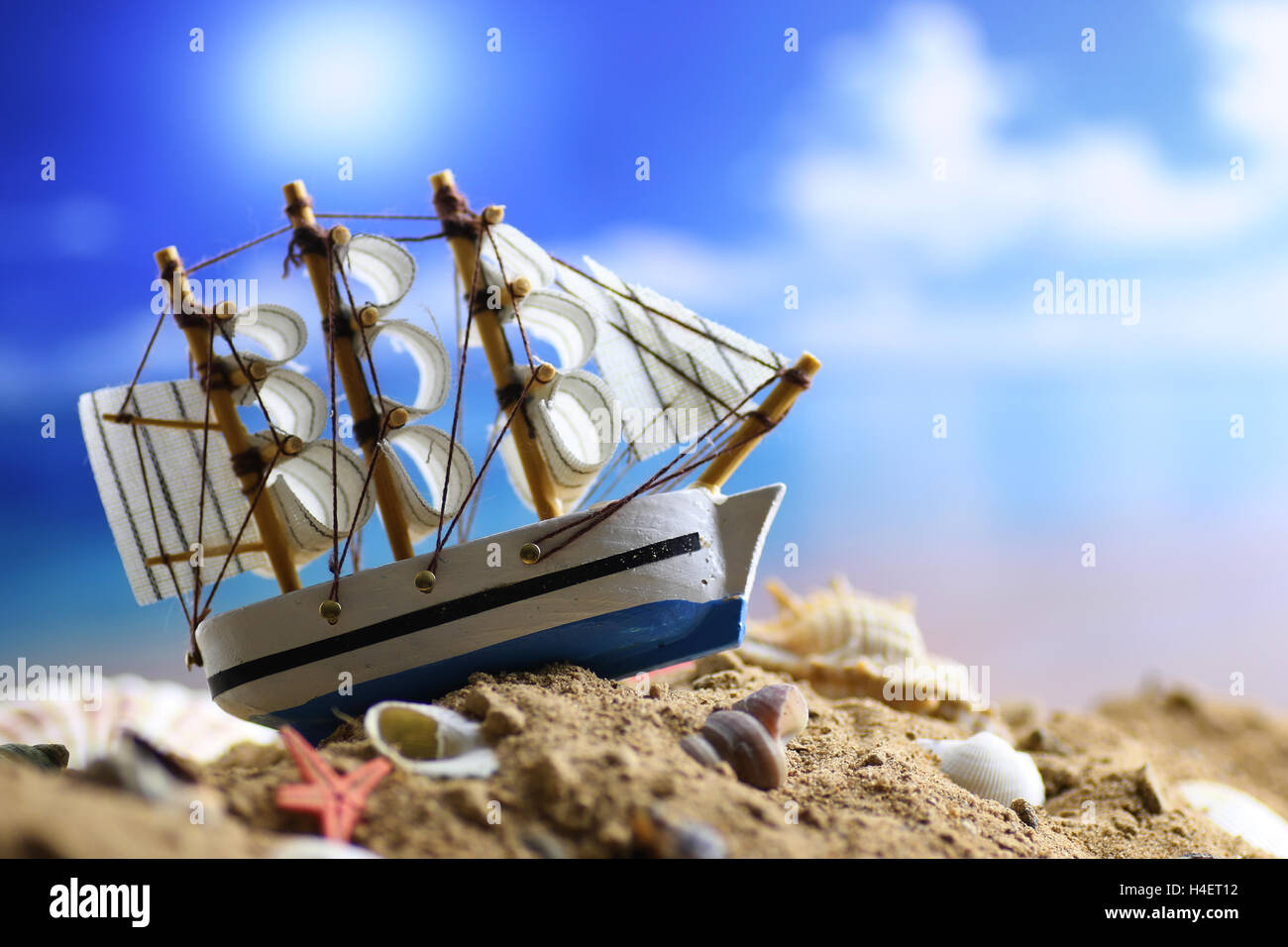 sand shell and sail in sea Stock Photo - Alamy