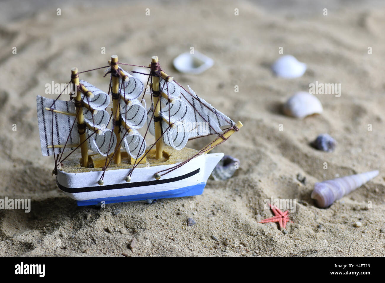 sand shell and sail in sea Stock Photo - Alamy