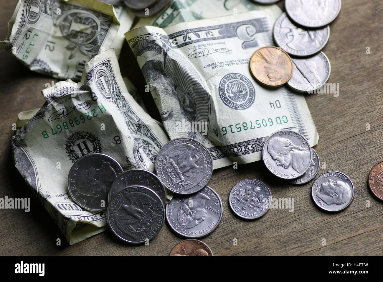 change and crumpled banknote Stock Photo - Alamy