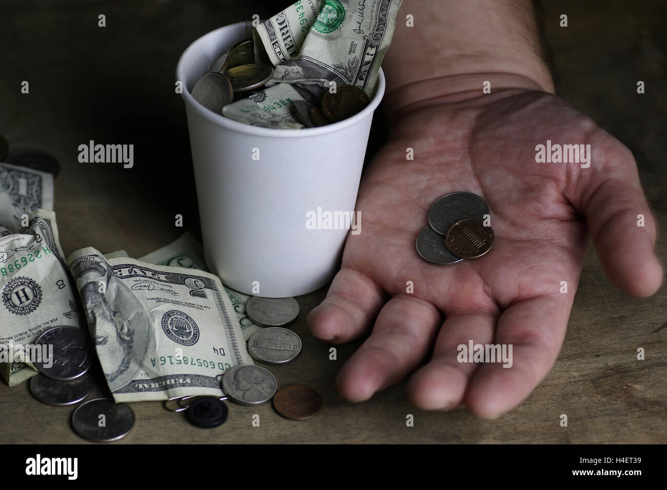 begging coin money Stock Photo - Alamy