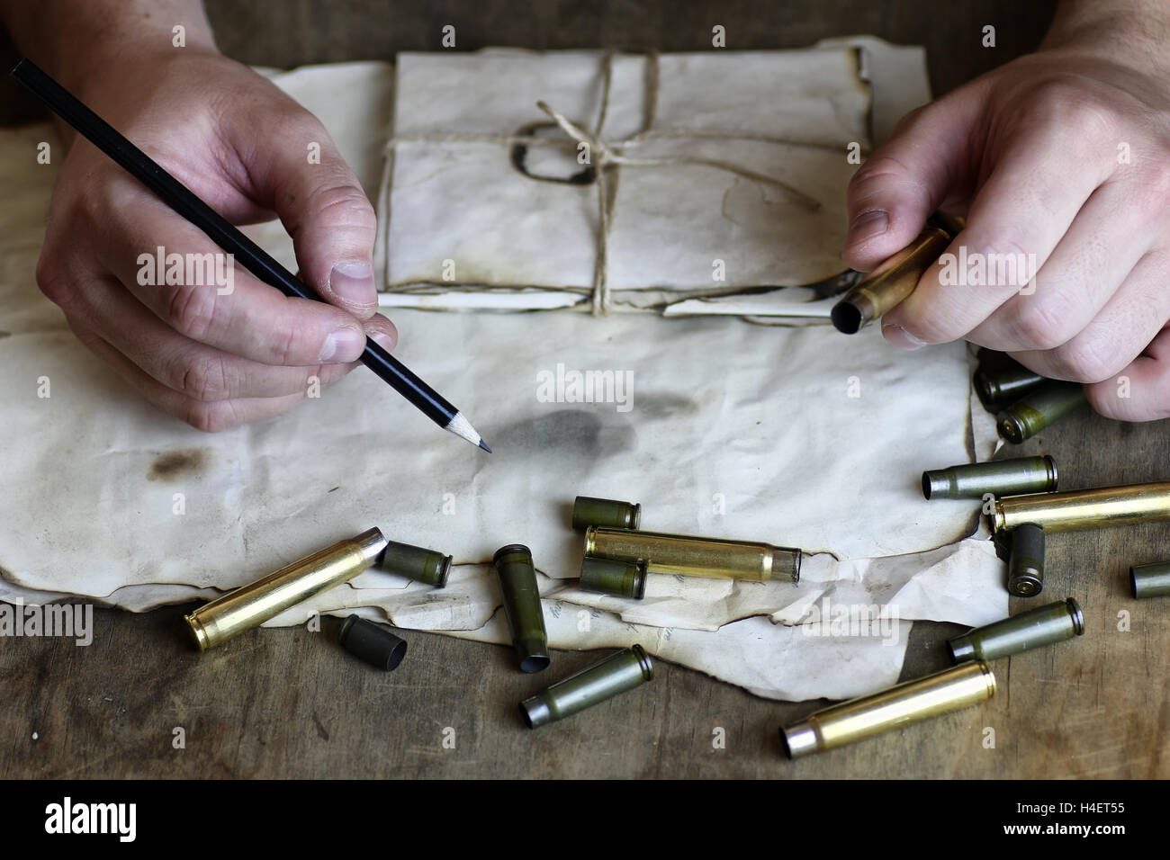 man write letter retro bullet on the table Stock Photo - Alamy