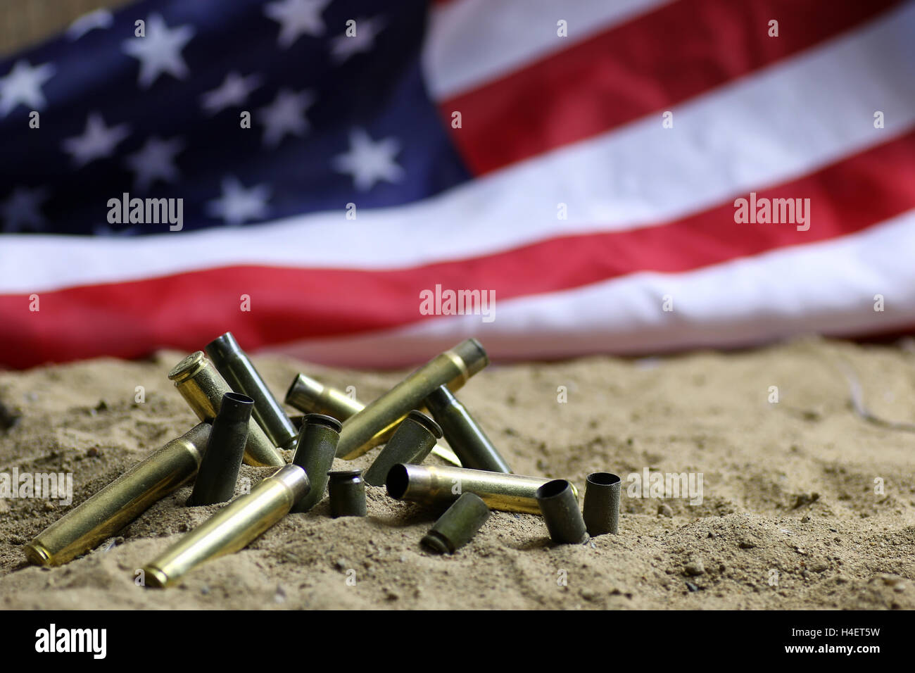 bullet and usa flag in sand war Stock Photo - Alamy
