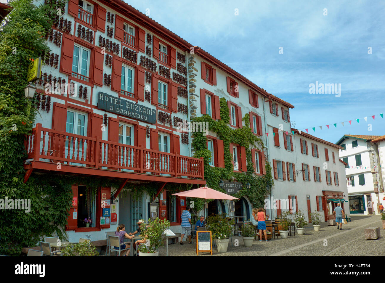 Red peppers drying on facades of Euzkadi restaurant in Espelette ...