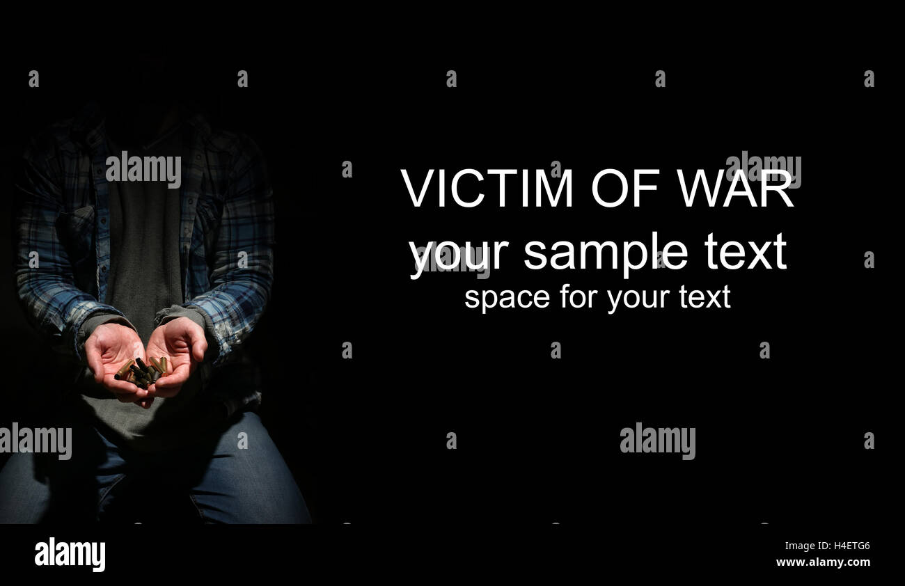 bullet in hands man Stock Photo - Alamy