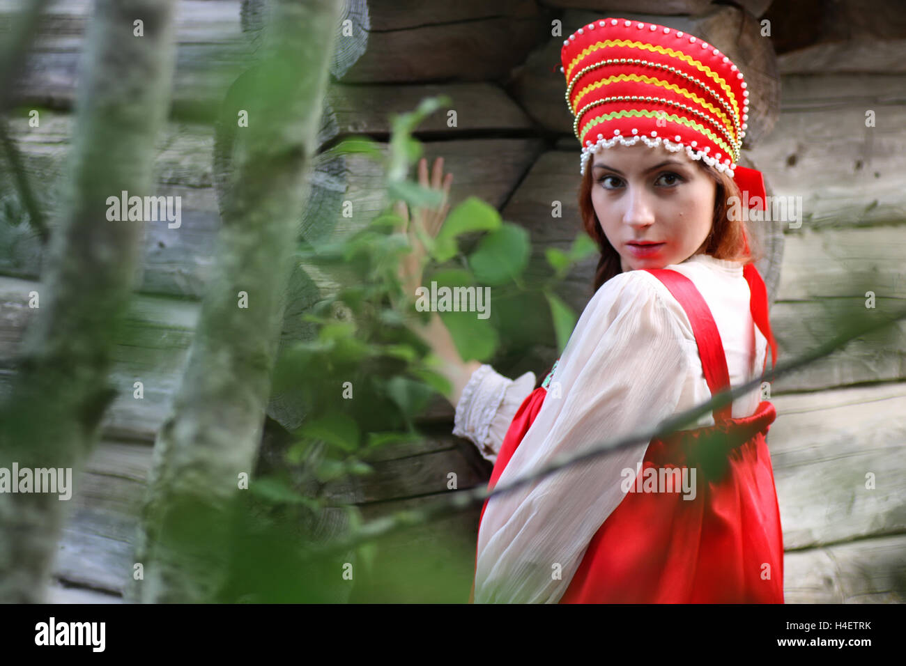 girl traditional dress log Stock Photo - Alamy