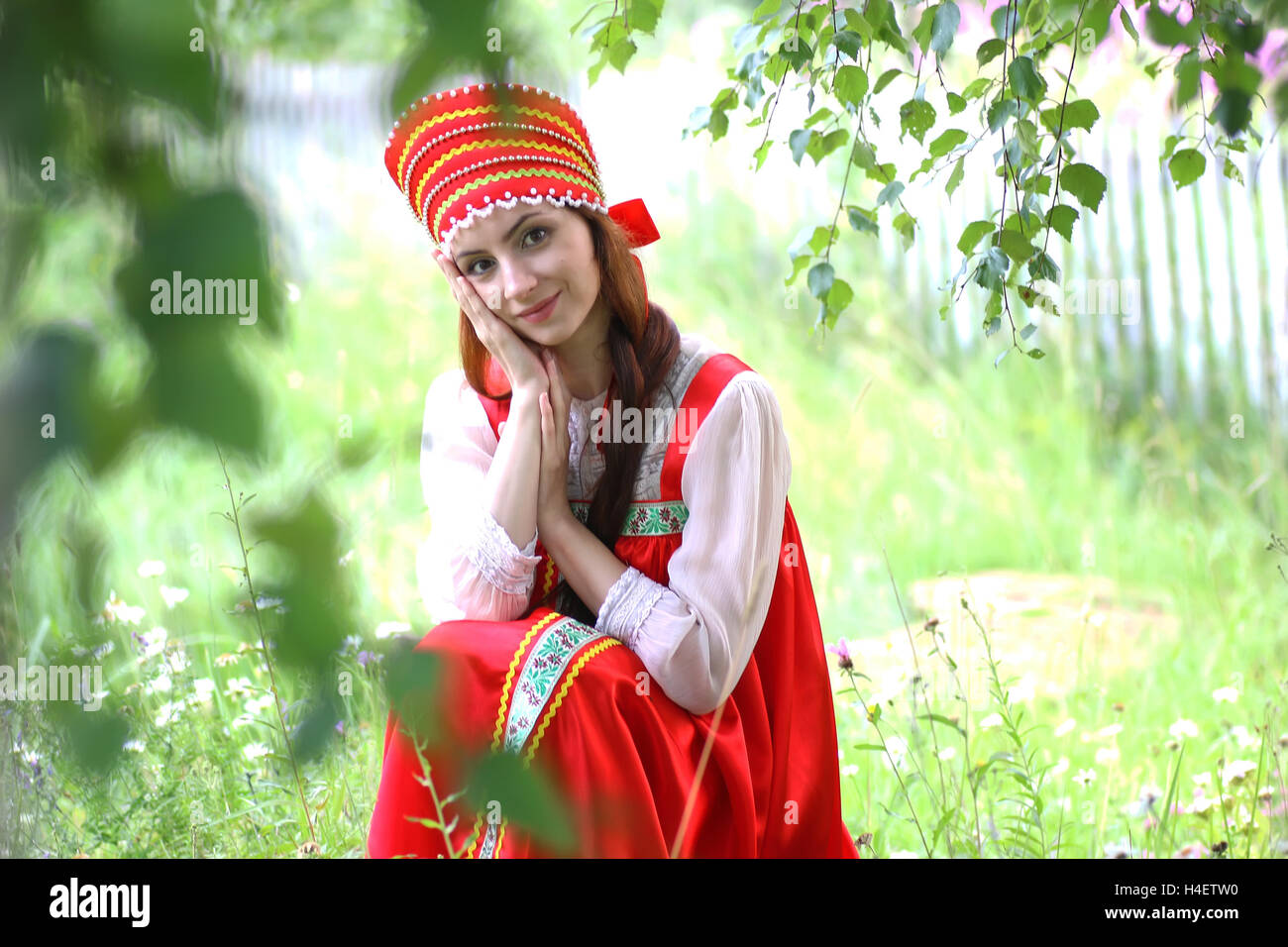 Slav in traditional dress is sitting in nature Stock Photo - Alamy
