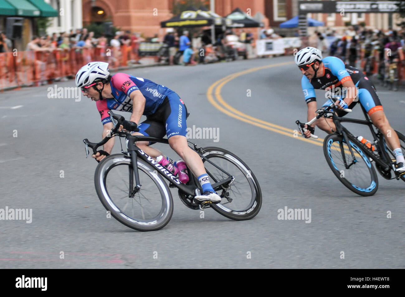 sharp turn and high speed forcing bike racers in the breakaway to lean ...