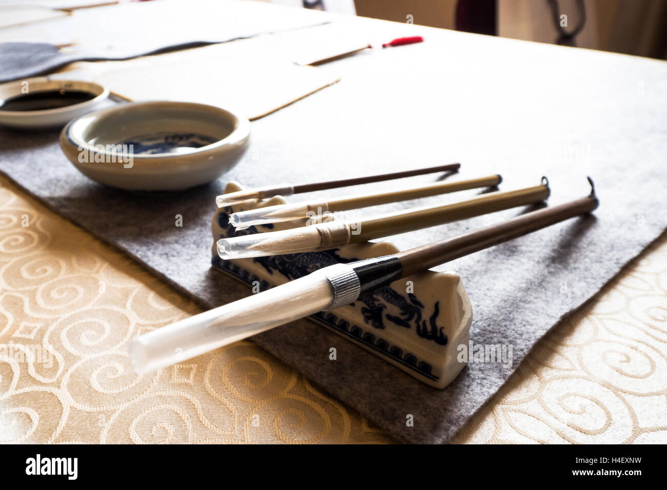 chinese calligraphy tools on table Stock Photo - Alamy