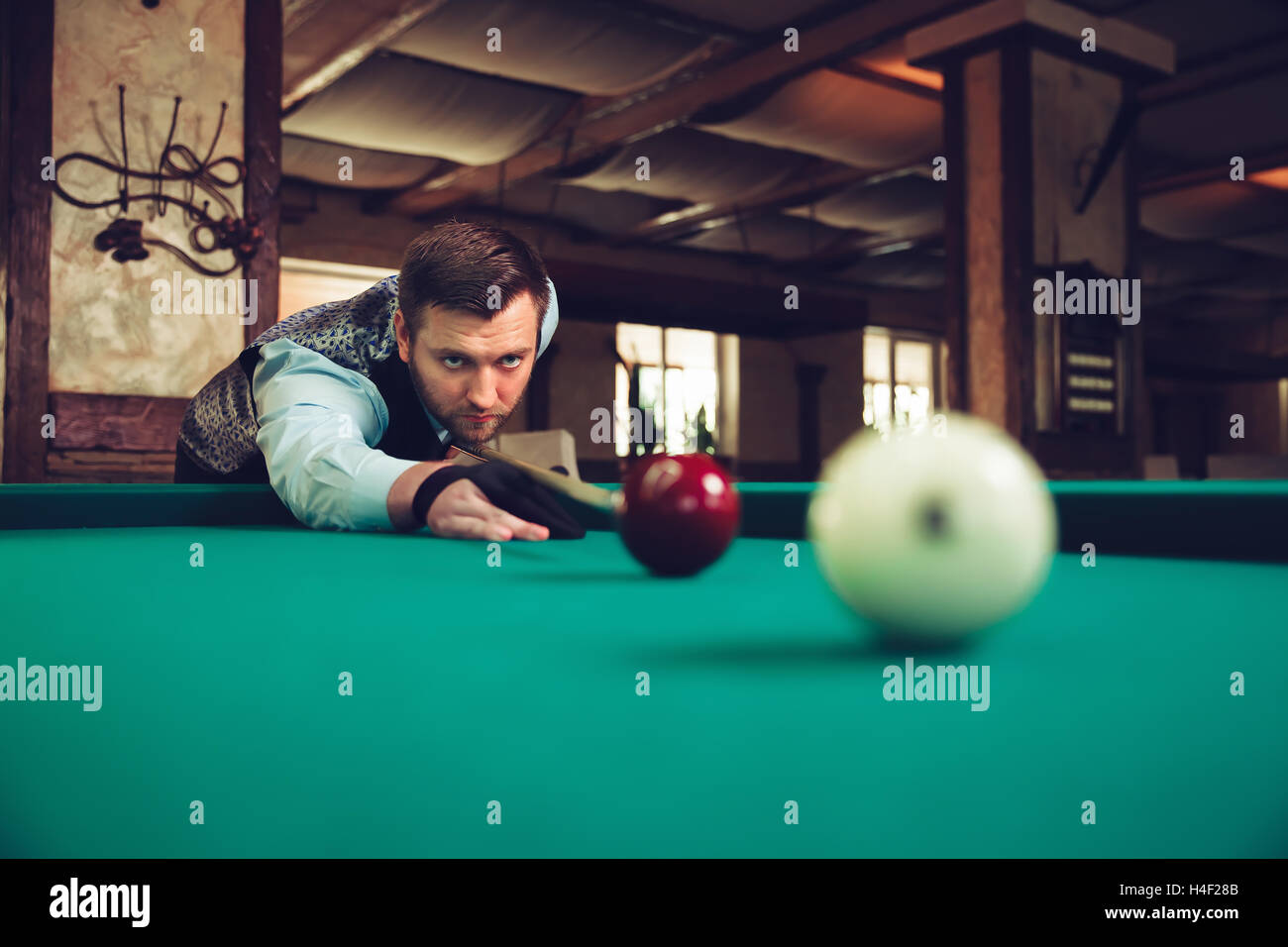 Man playing billiard Stock Photo - Alamy