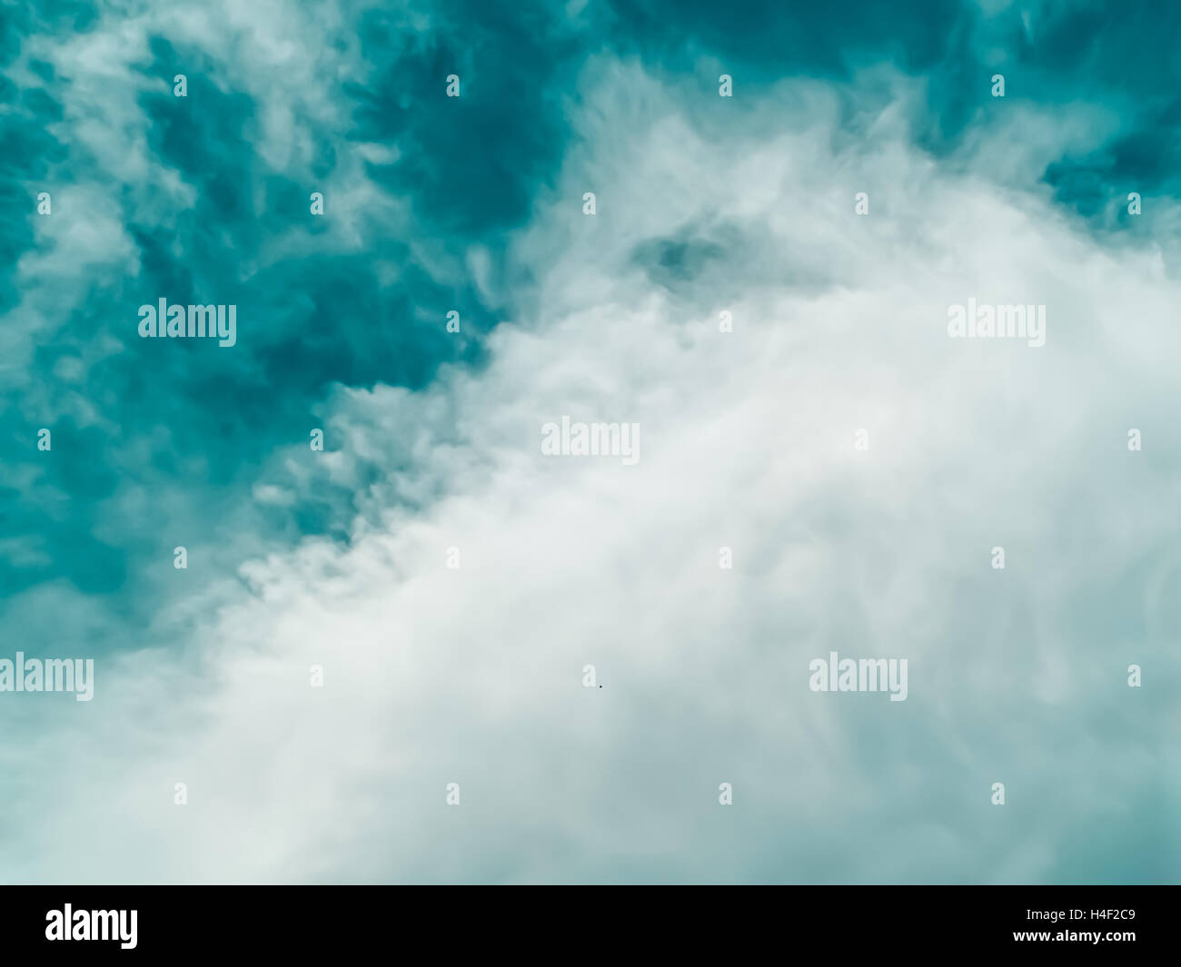 Soft cloud moving by wind and light blue sky background Stock Photo - Alamy